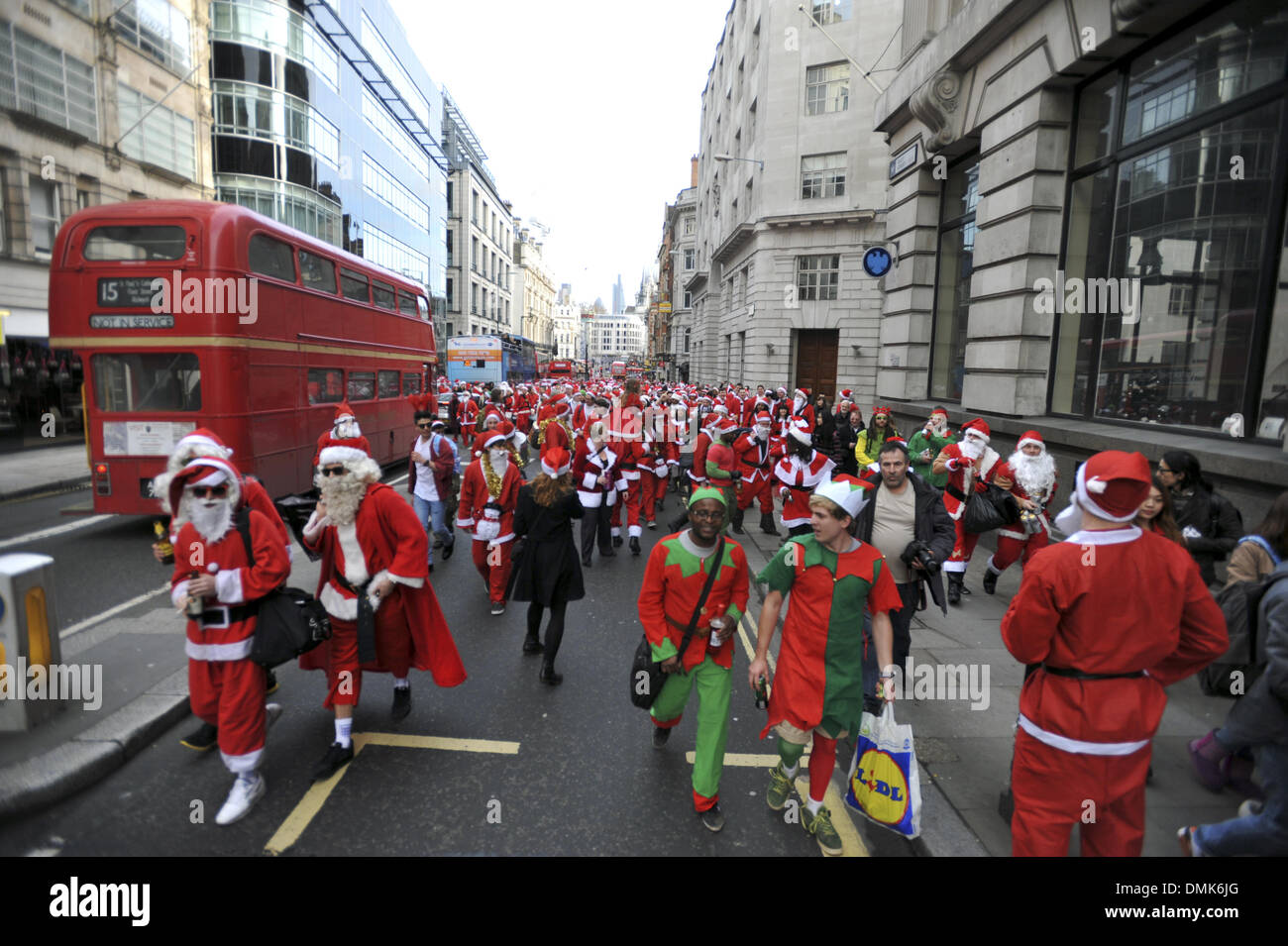 London, UK. 14th December 2013. 'Santacon', a Santa Claus parade ...