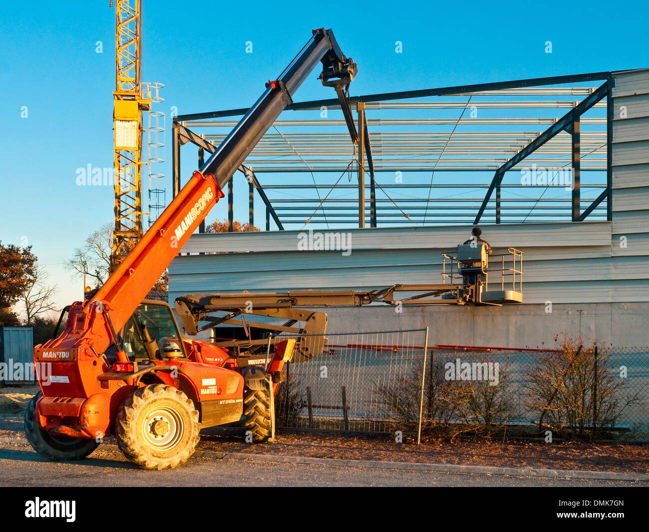 Manitou mobile cranes / metal cladding panels being fitted on factory ...