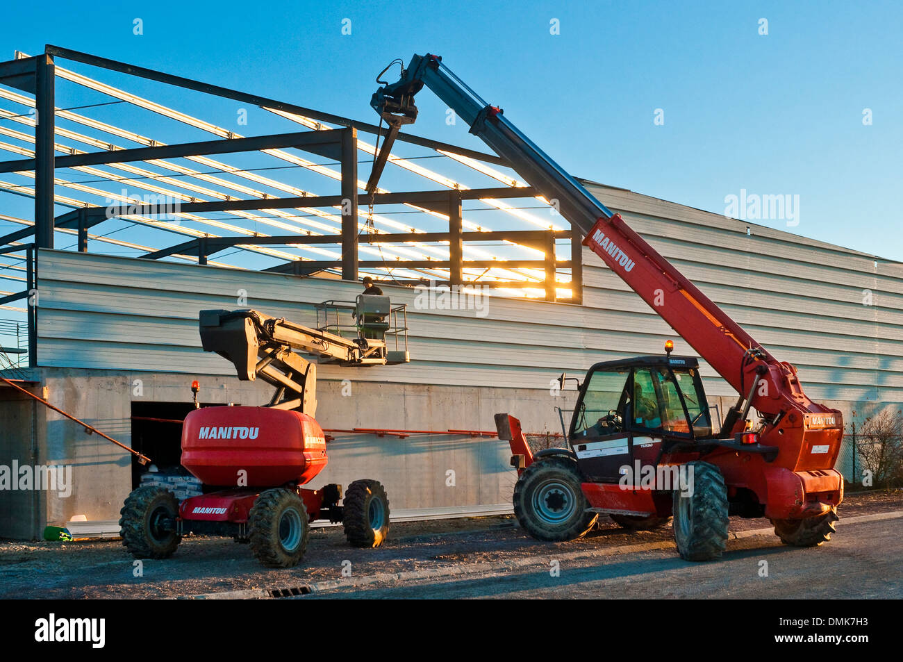 Manitou mobile cranes / metal cladding panels being fitted on factory ...