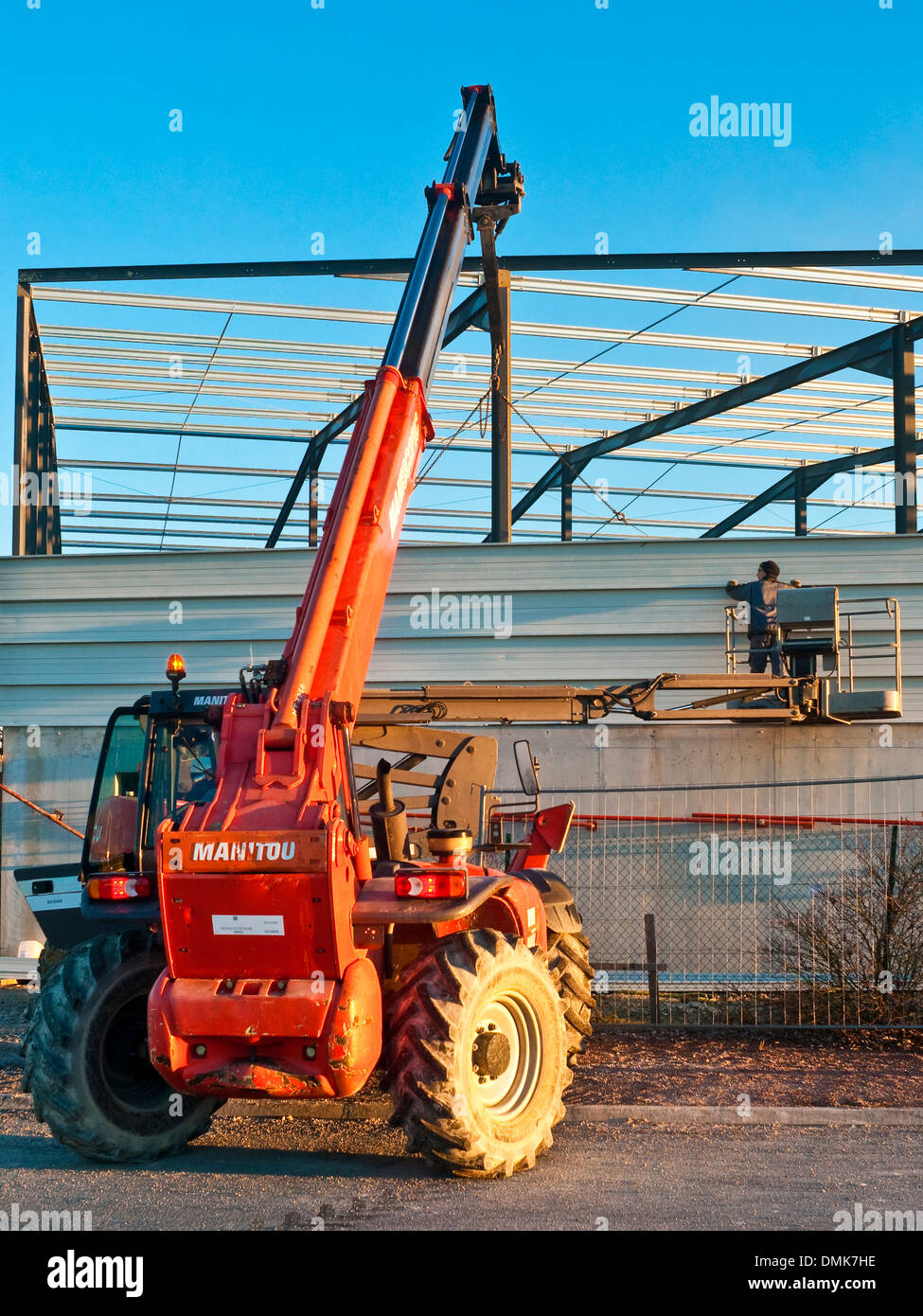 Manitou mobile cranes / metal cladding panels being fitted on factory ...