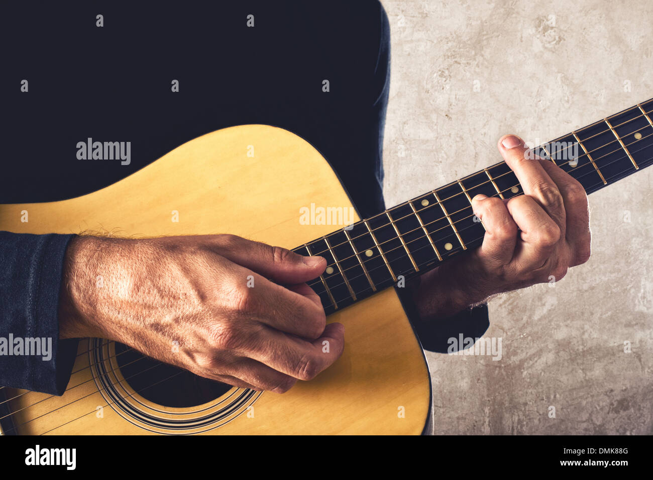 Man playing acoustic guitar, unplugged performance Stock Photo - Alamy