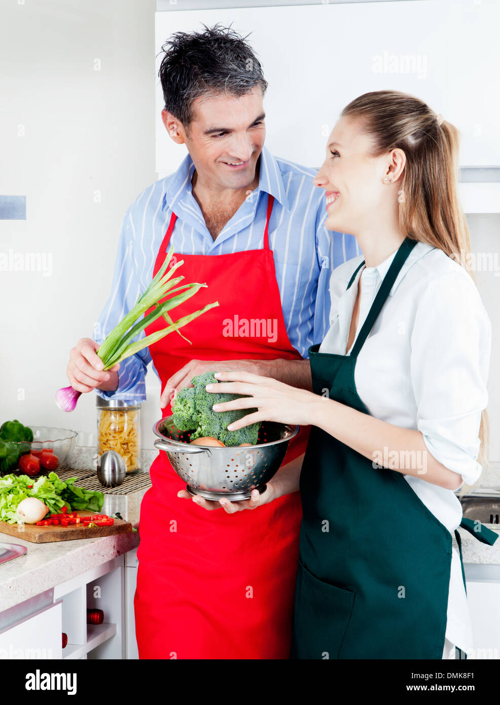 Man and Woman Cooking in Kitchen Stock Photo - Alamy