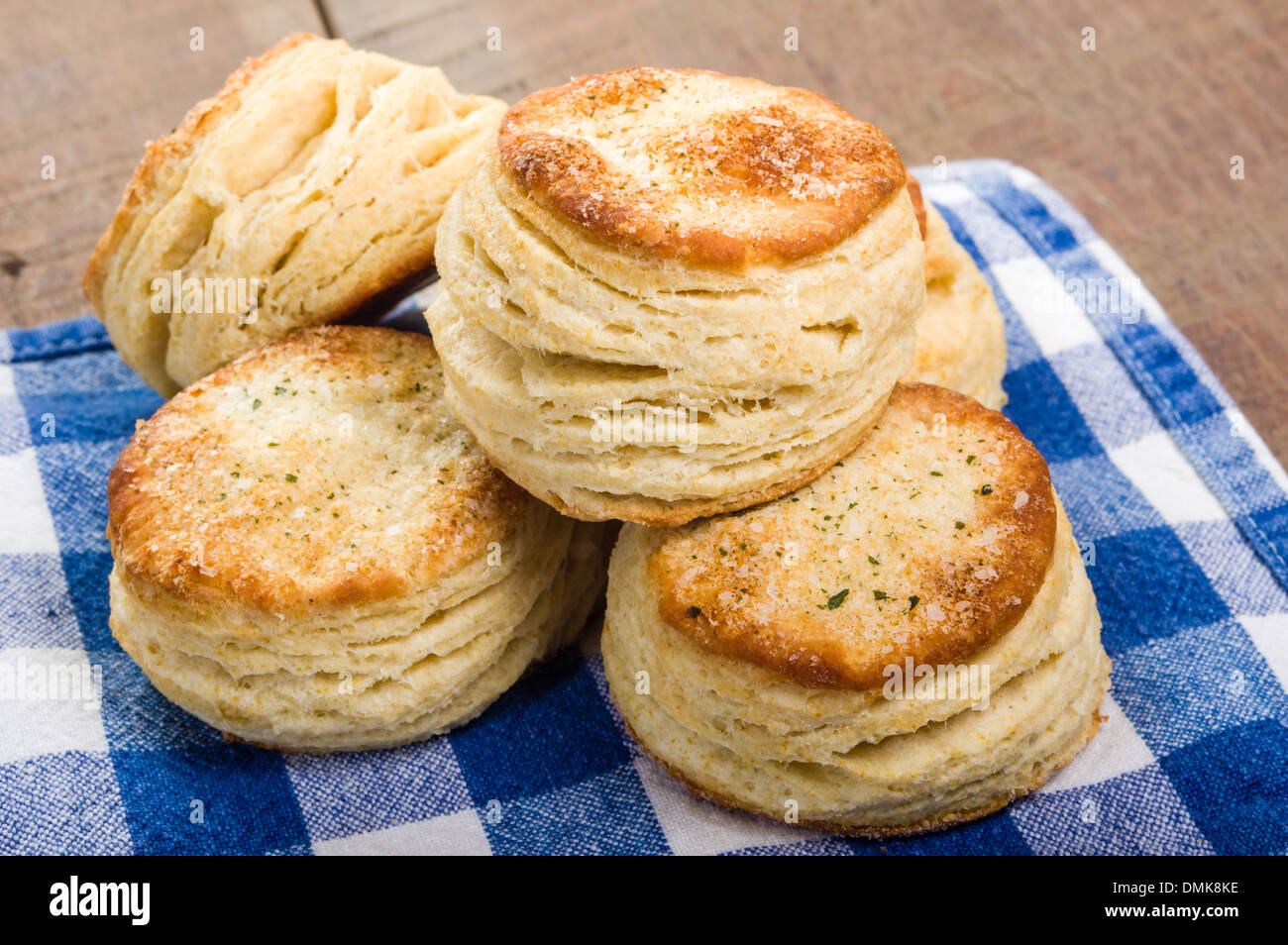 Fresh baked biscuits on a blue checked cloth Stock Photo - Alamy