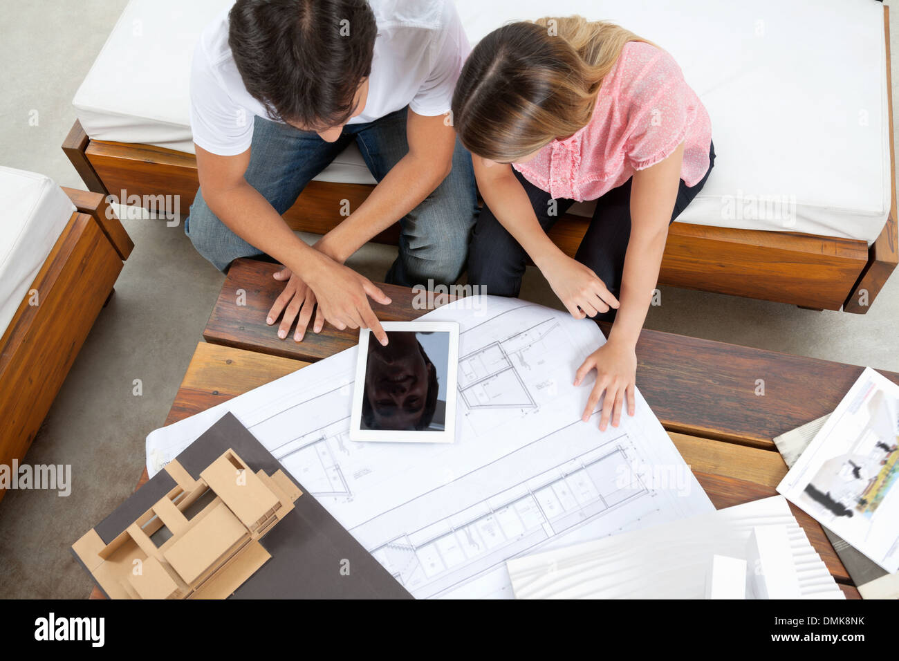 Young couple house plans hi-res stock photography and images - Alamy
