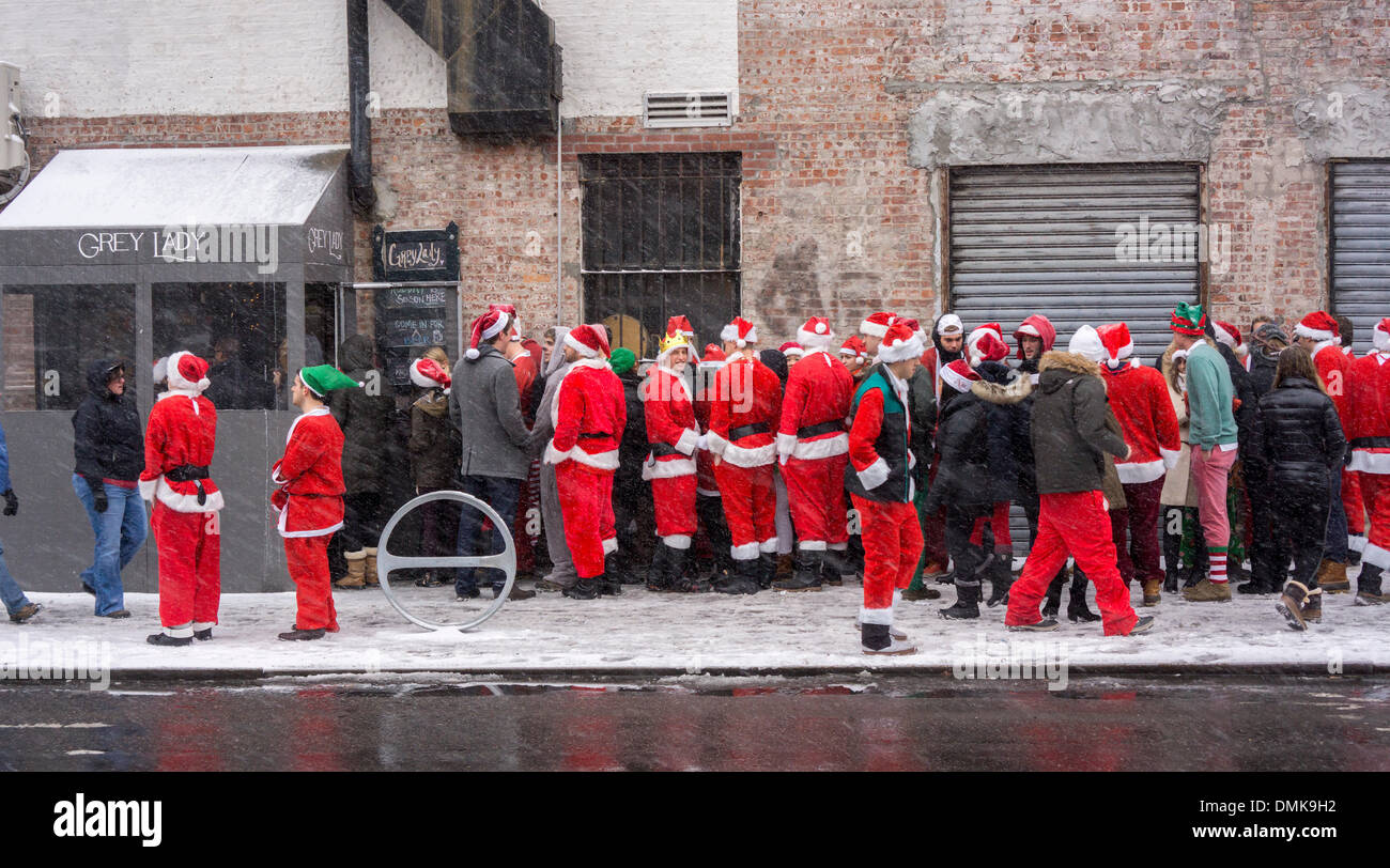 Santas and their elves outside the Grey Lady bar in the Lower East Side ...