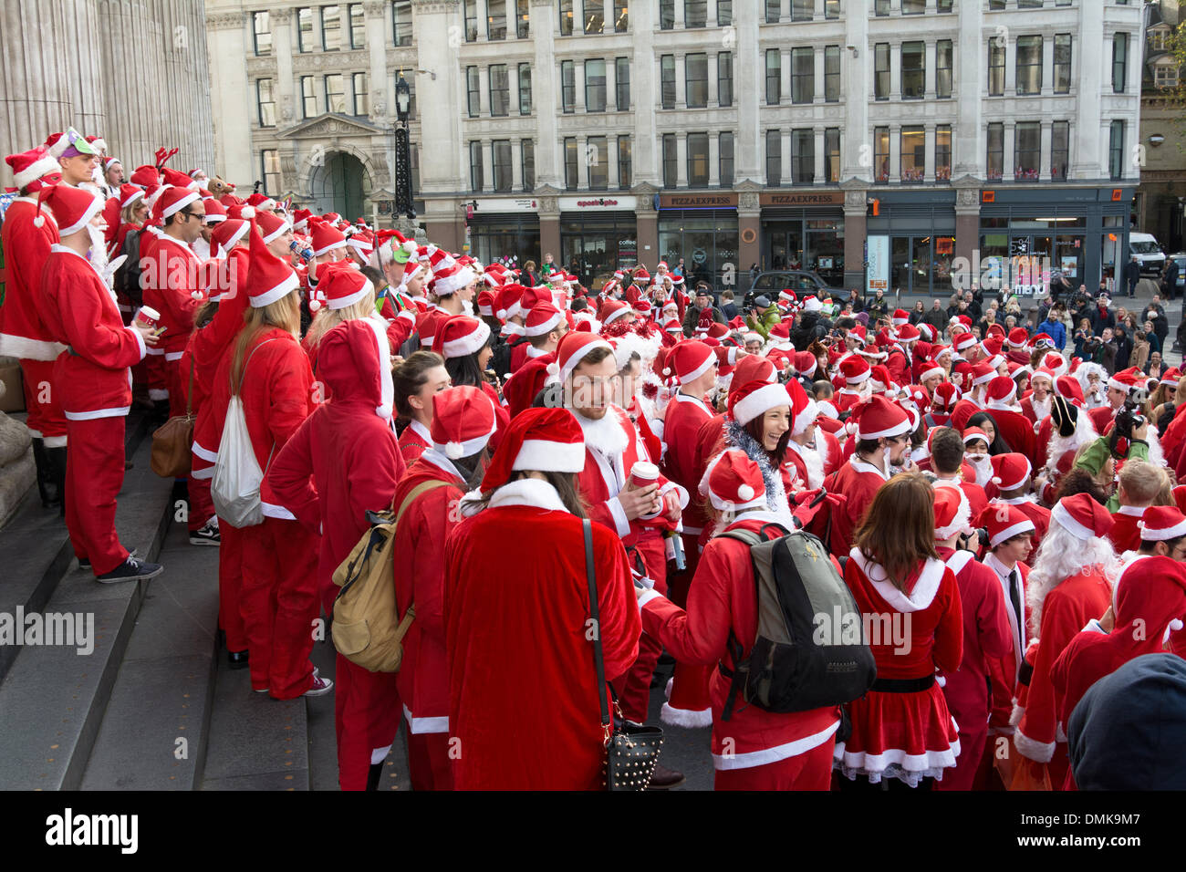 London, UK, 14th Dec, 2013. Revellers get into the Christmas spirit on ...
