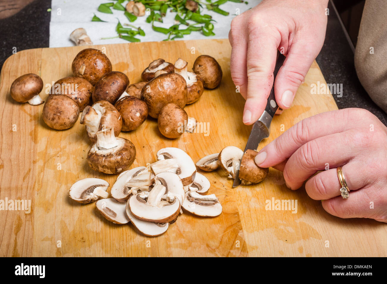 Slicing mushrooms on cutting board hi-res stock photography and images ...