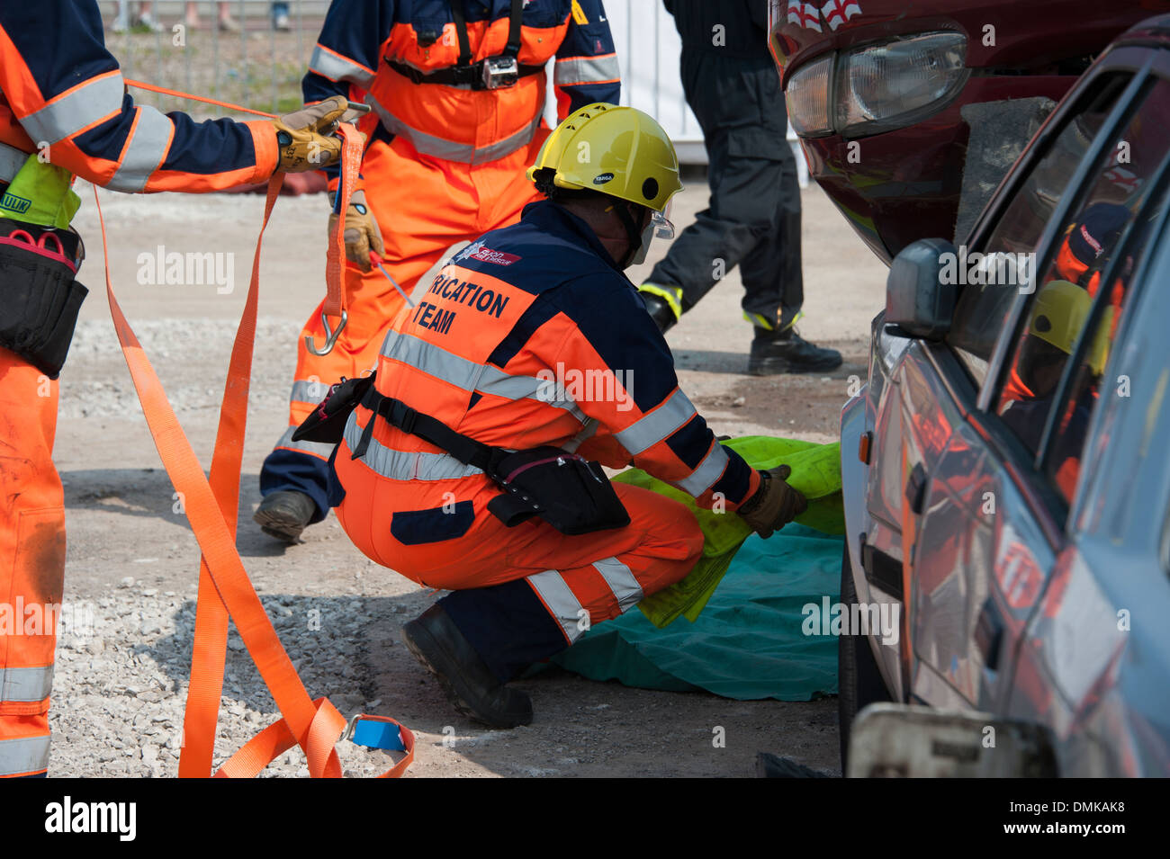 Firefighters rescuing person from car crash SIMULATION Stock Photo - Alamy