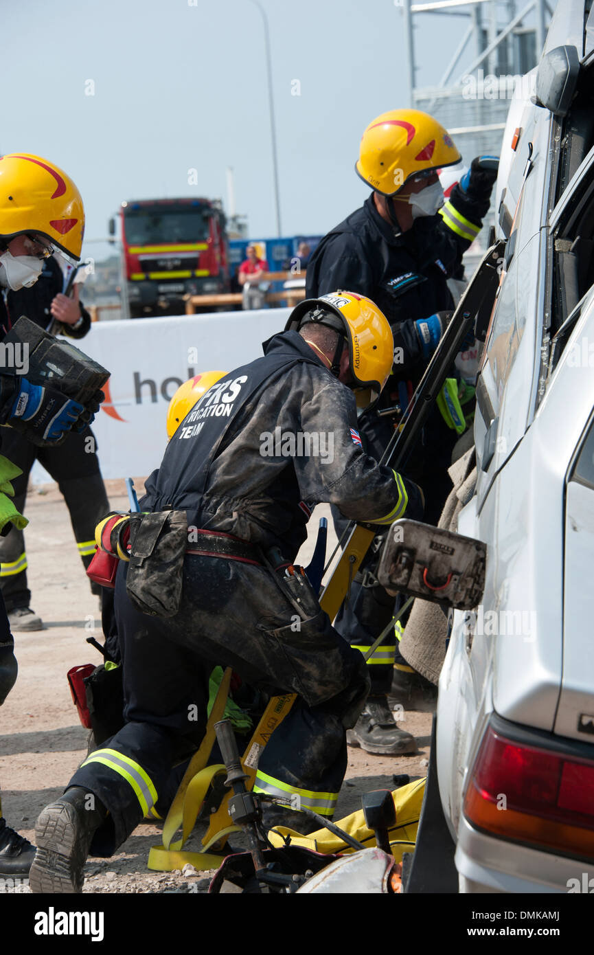 Firefighters car crash extrication RTA RTC SIMULATION Stock Photo - Alamy