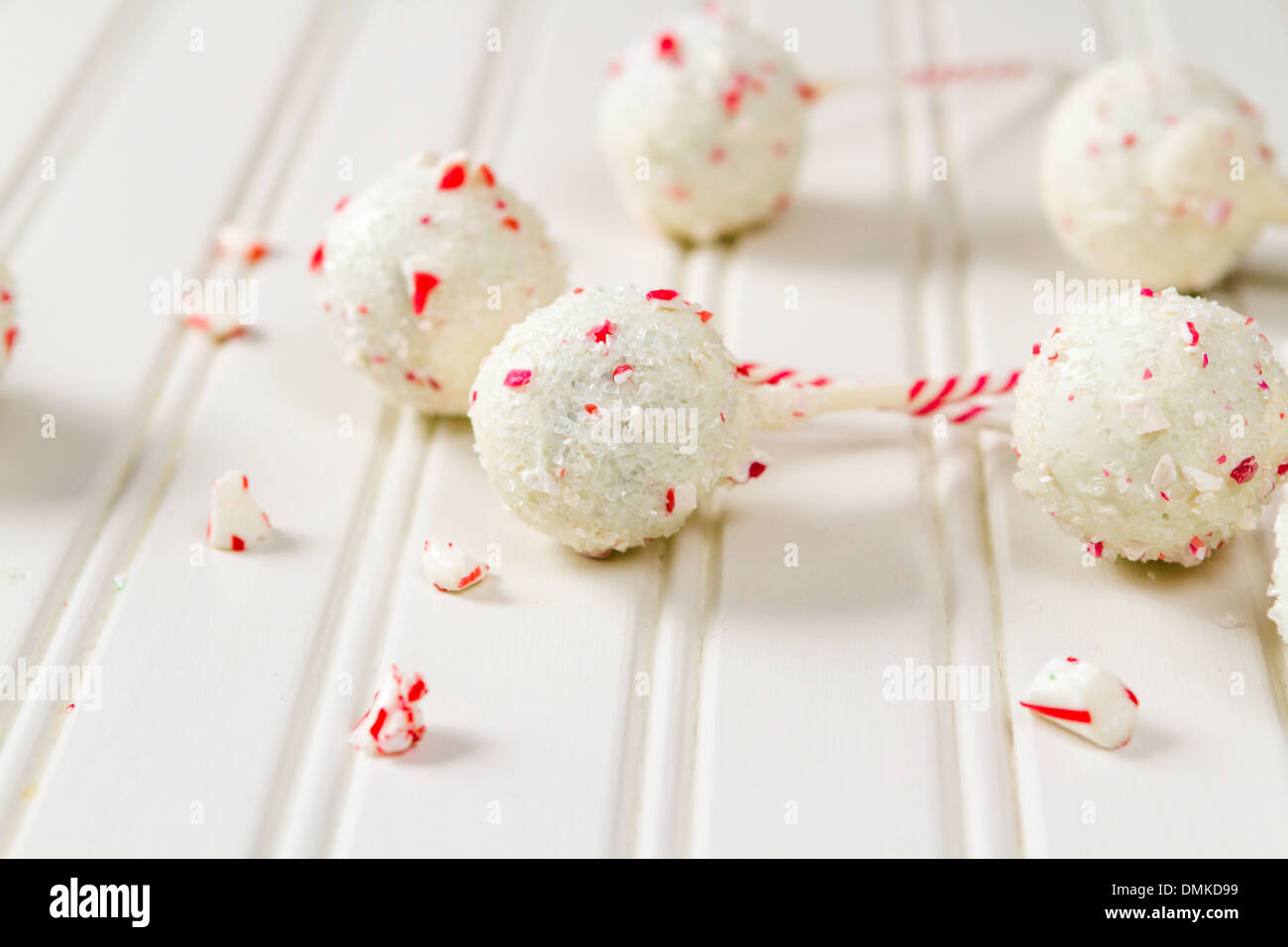 Peppermint chocolate cake pops dipped in white chocolate and candy cane ...