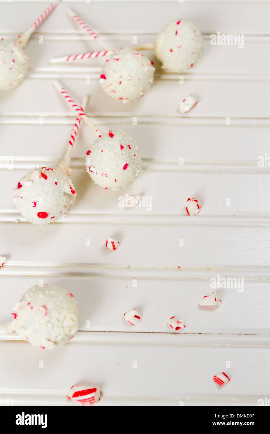 Peppermint chocolate cake pops dipped in white chocolate and candy cane ...