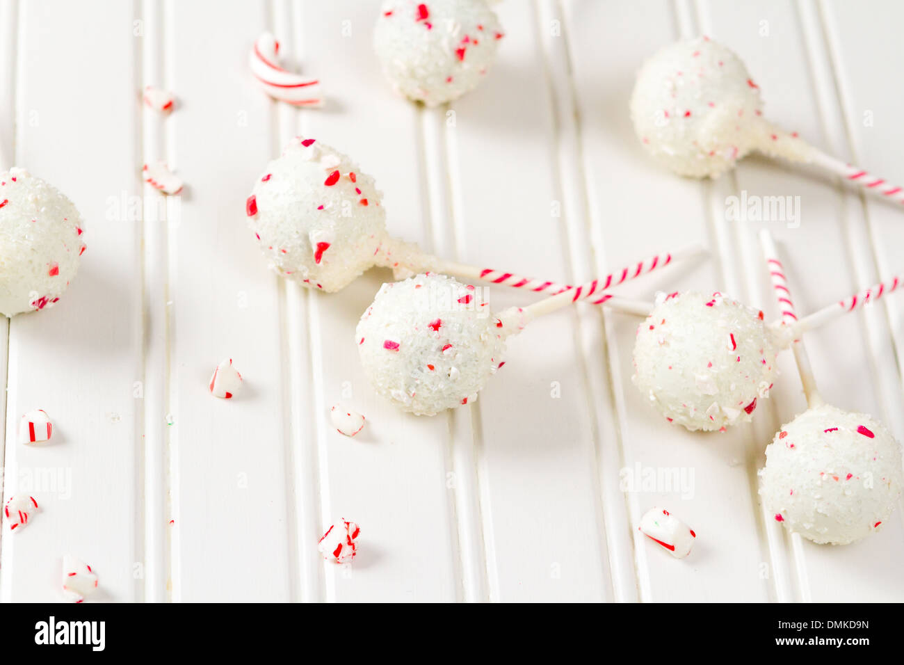 Peppermint chocolate cake pops dipped in white chocolate and candy cane ...