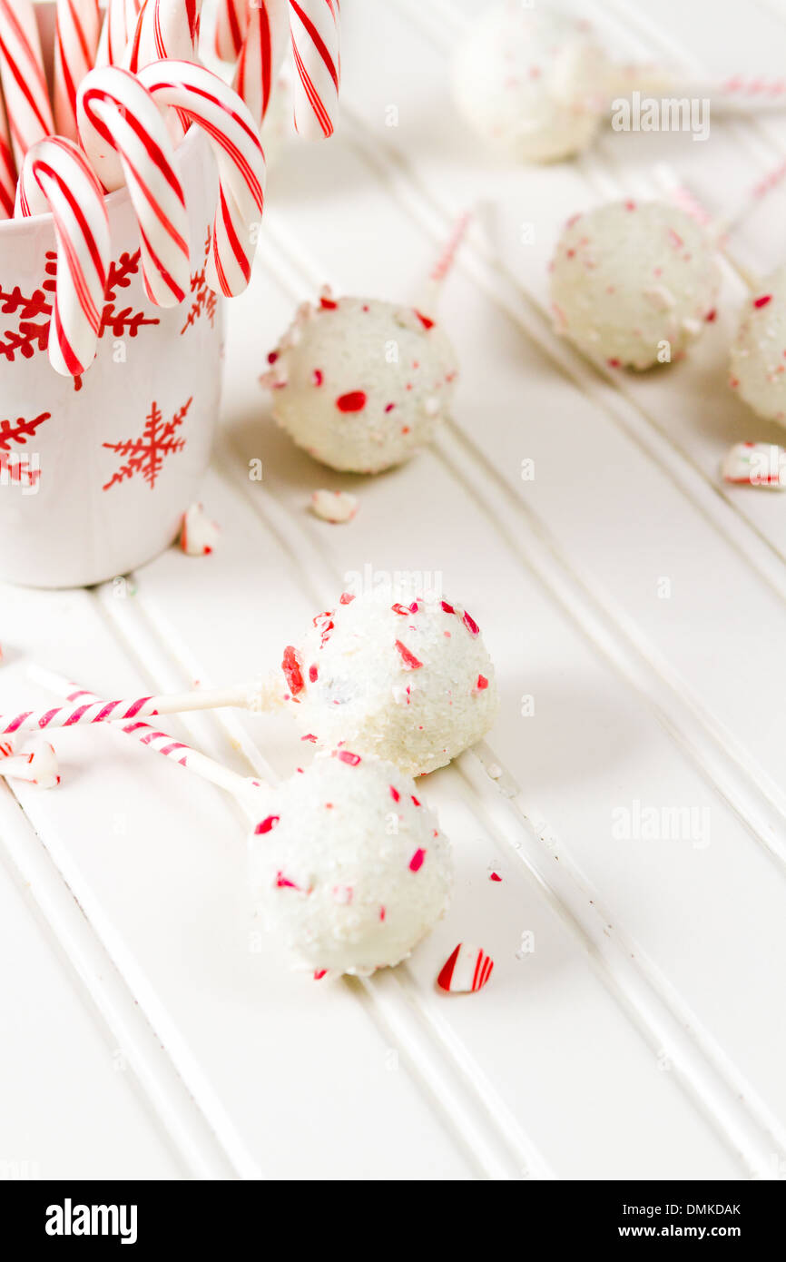 Peppermint chocolate cake pops dipped in white chocolate and candy cane ...