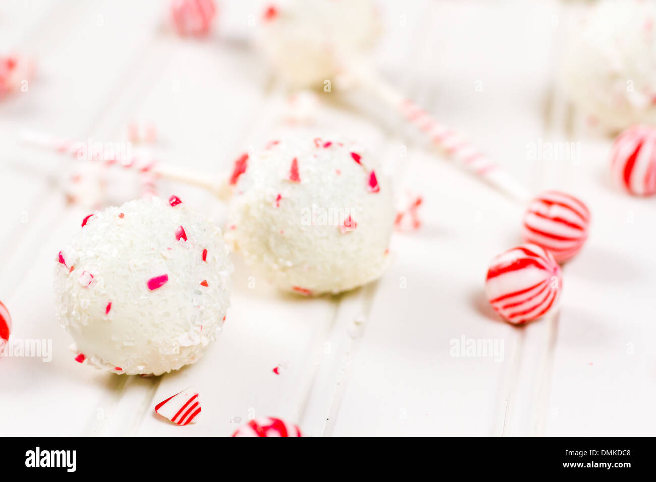 Peppermint chocolate cake pops dipped in white chocolate and candy cane ...