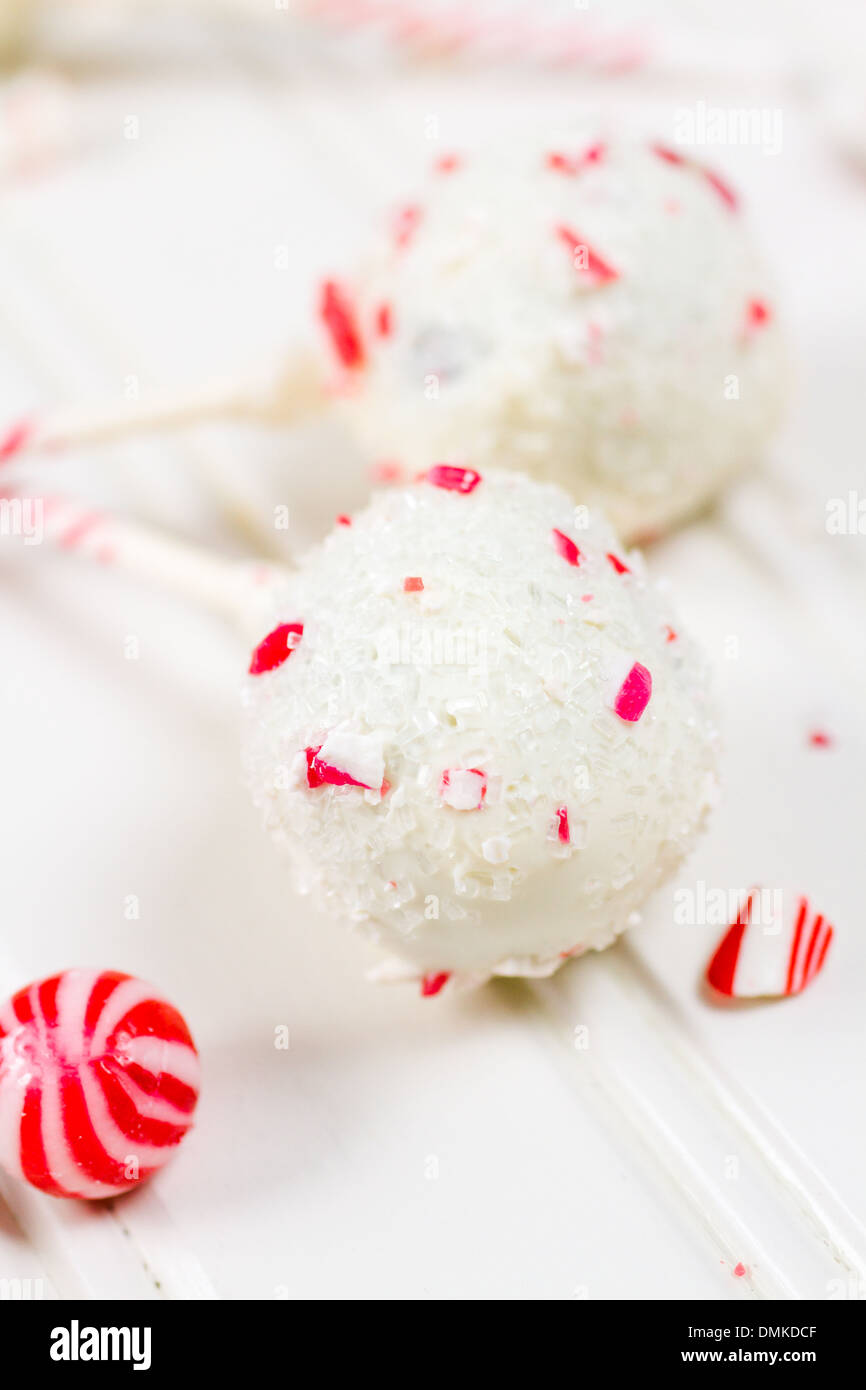 Peppermint chocolate cake pops dipped in white chocolate and candy cane ...