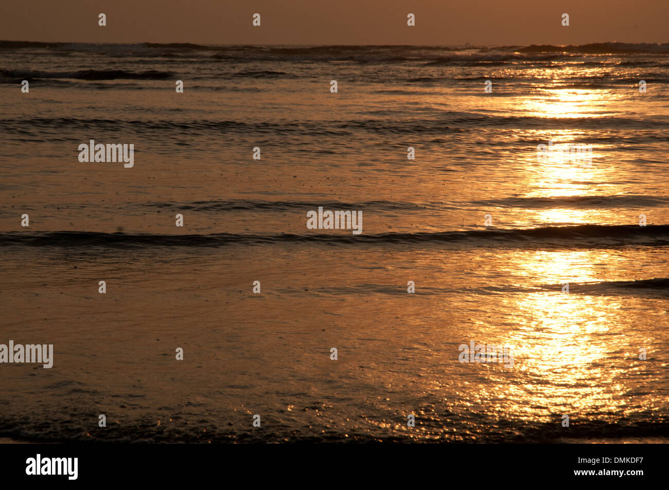 A golden sunset on the beach in Goa, India Stock Photo - Alamy