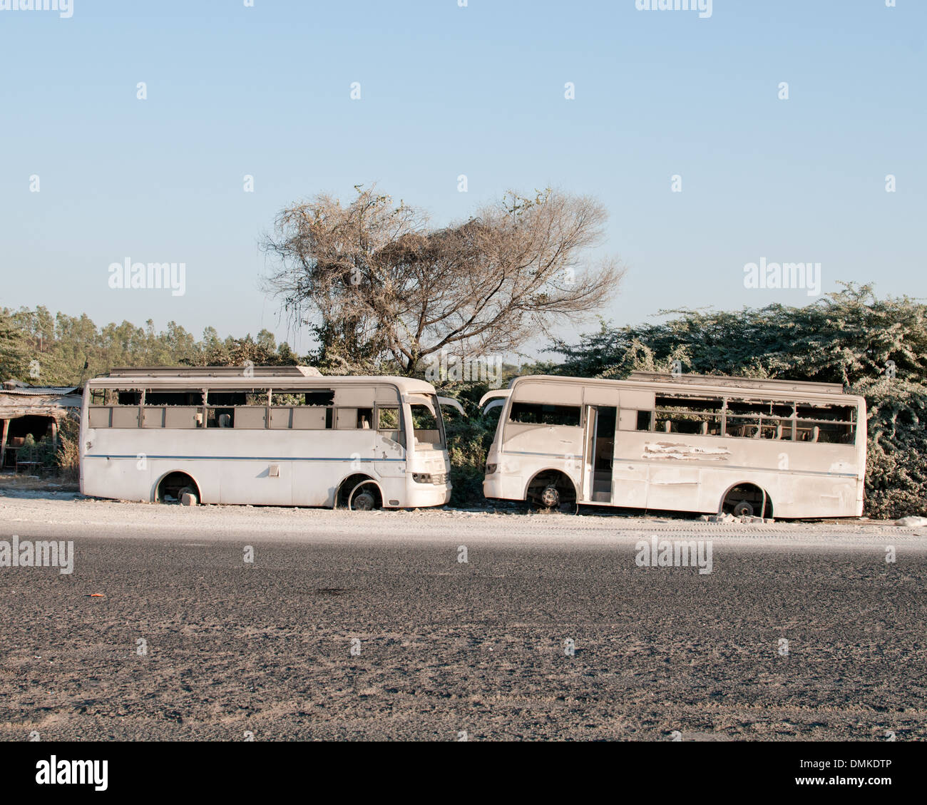 Two buses lay vacant on the side of the road in India Stock Photo - Alamy