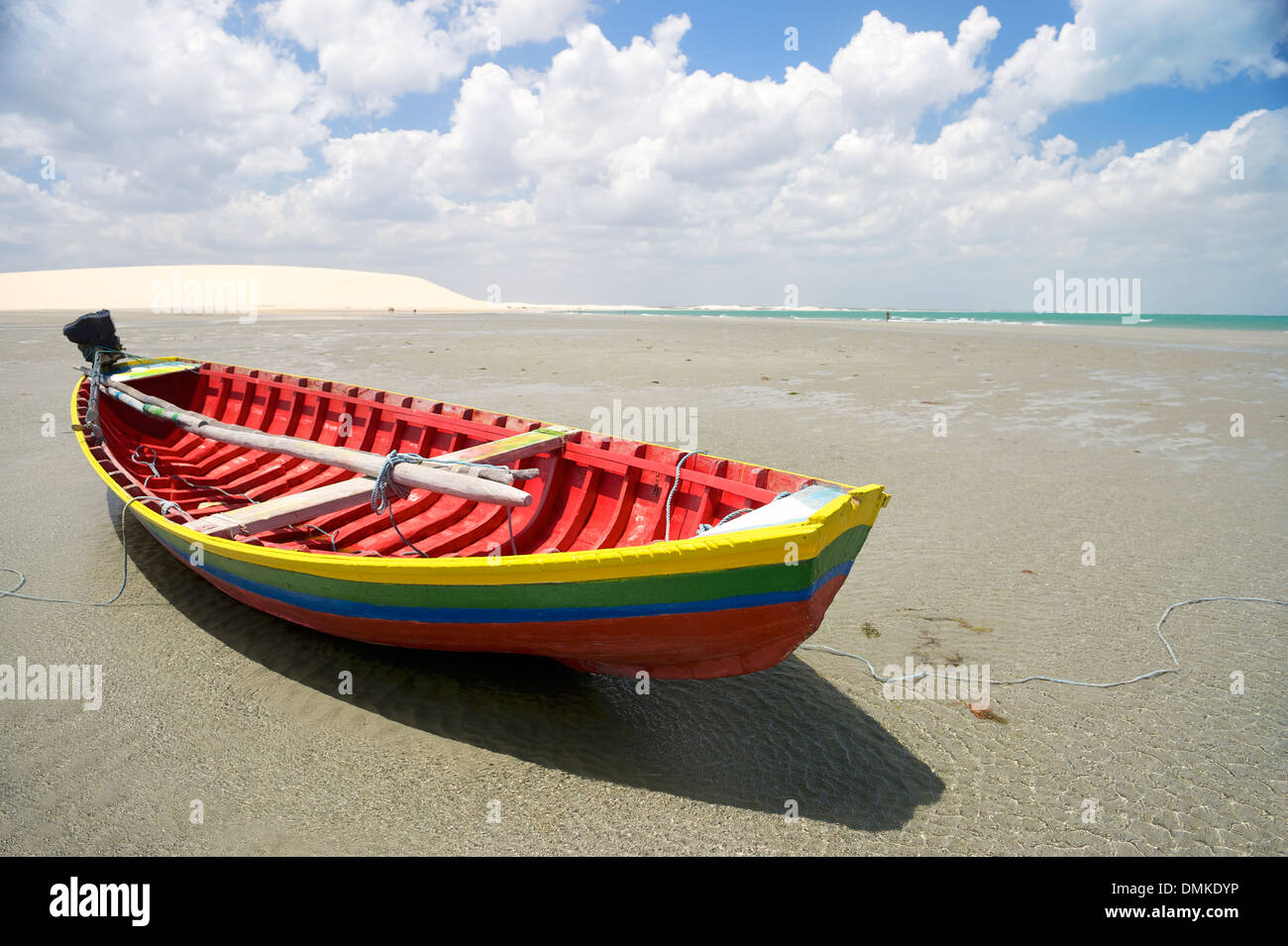 Traditional colorful Brazilian fishing boat on the beach in ...