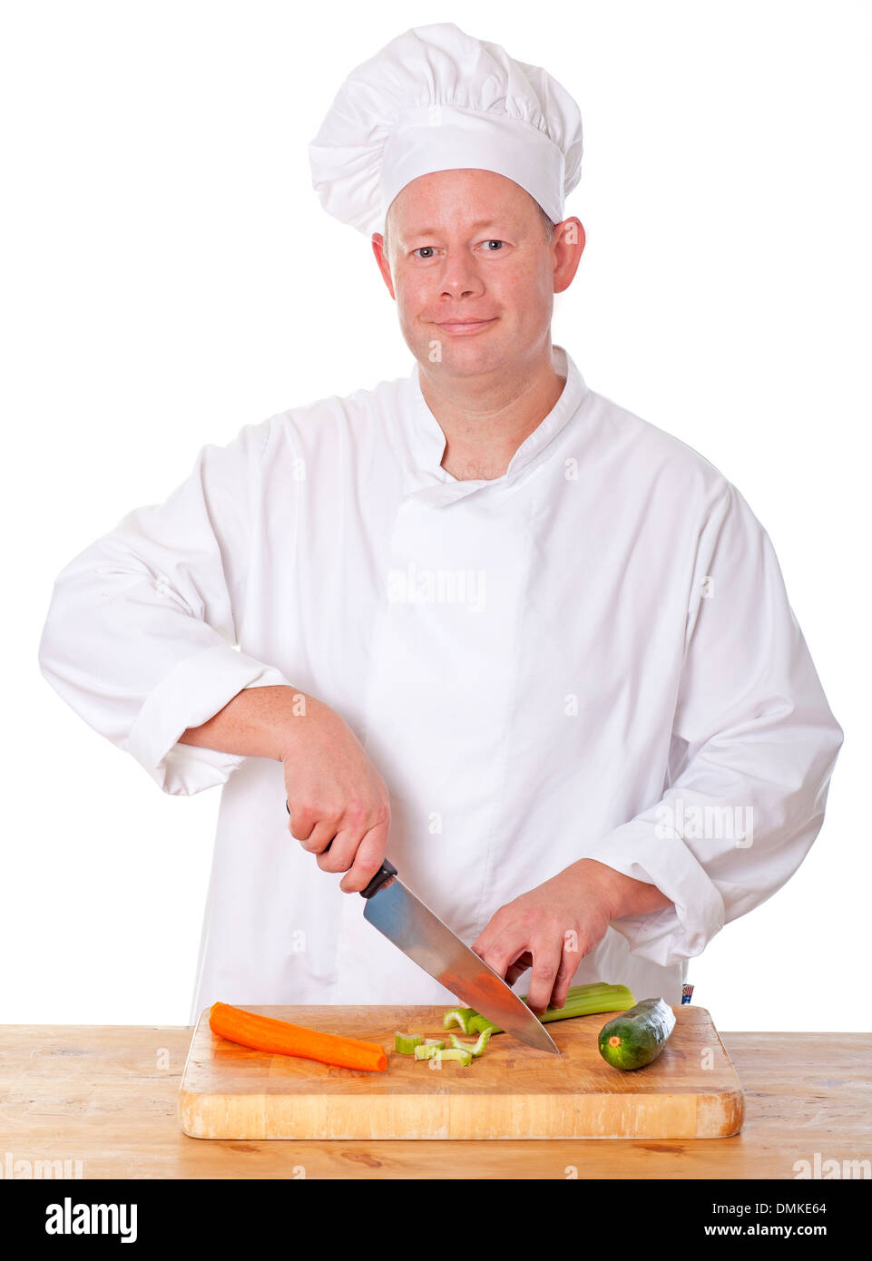 Male chef chopping vegetable on a chopping board isolated on white ...