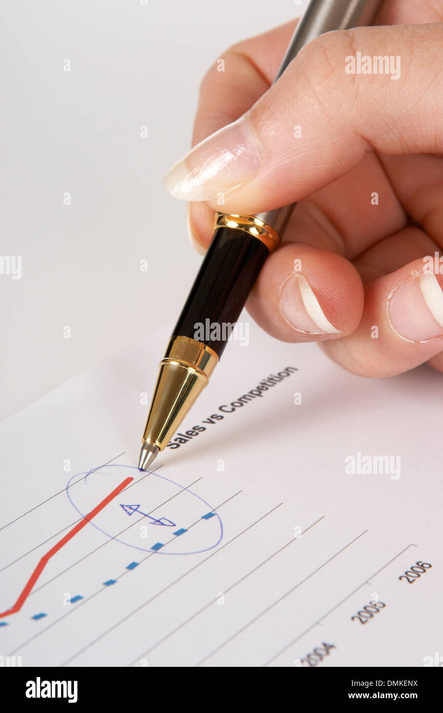 Hand and pen pointing at a diagram Stock Photo - Alamy