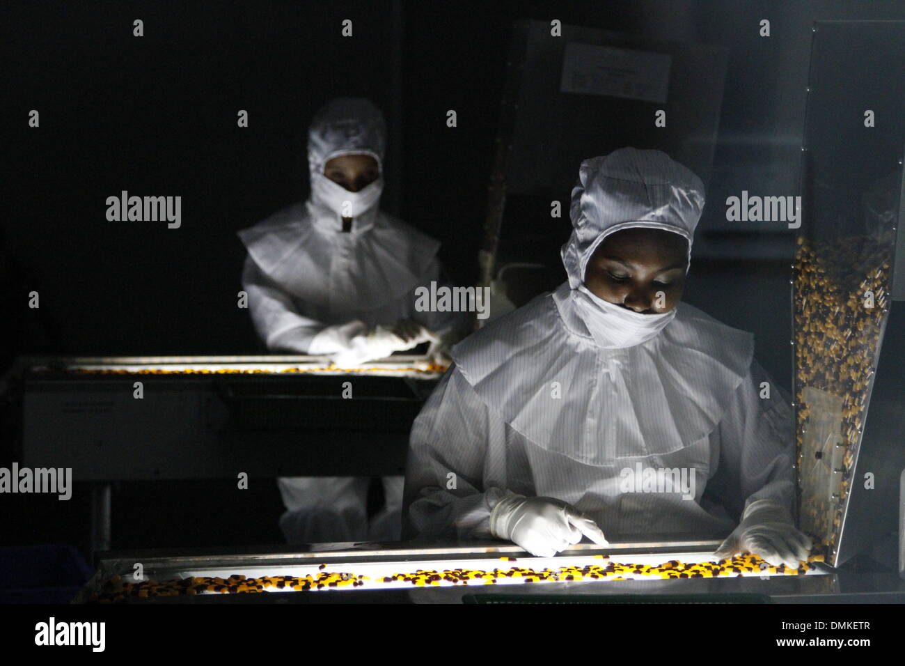 Addis Ababa, Ethiopia. 15th Dec, 2013. Staff members work at a capsule ...