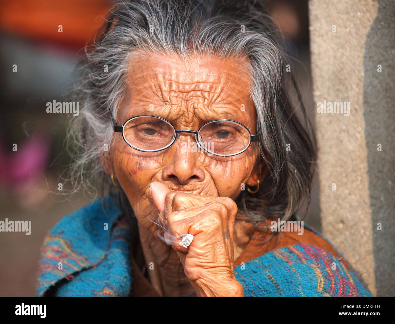 very old woman smoking cigarette Stock Photo - Alamy