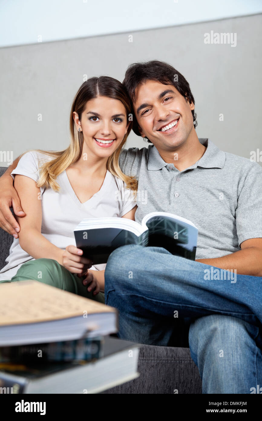 Young interracial couple reading book hi-res stock photography and ...