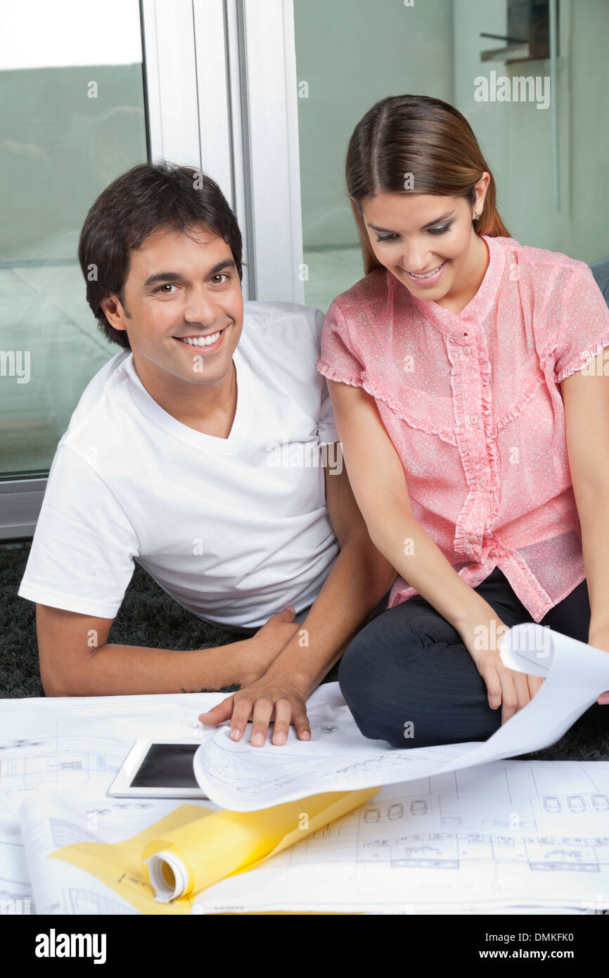 Couple With House Plans Stock Photo - Alamy