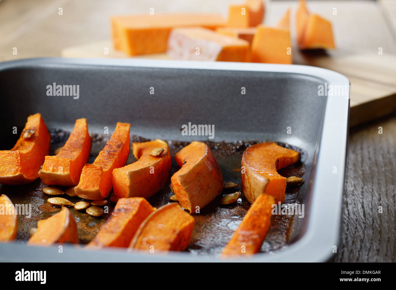 Homemade halloween baked pumpkin slices in baking pan Stock Photo - Alamy