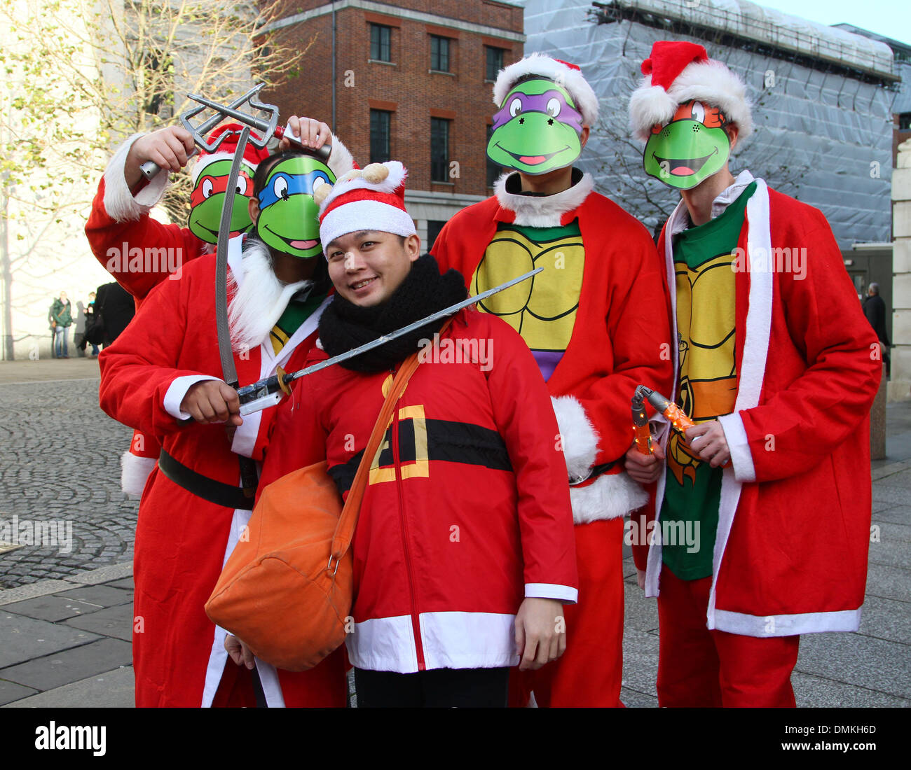 London, UK. 14th Dec 2013. Teenage Mutant Ninja Turtle's dressed as ...