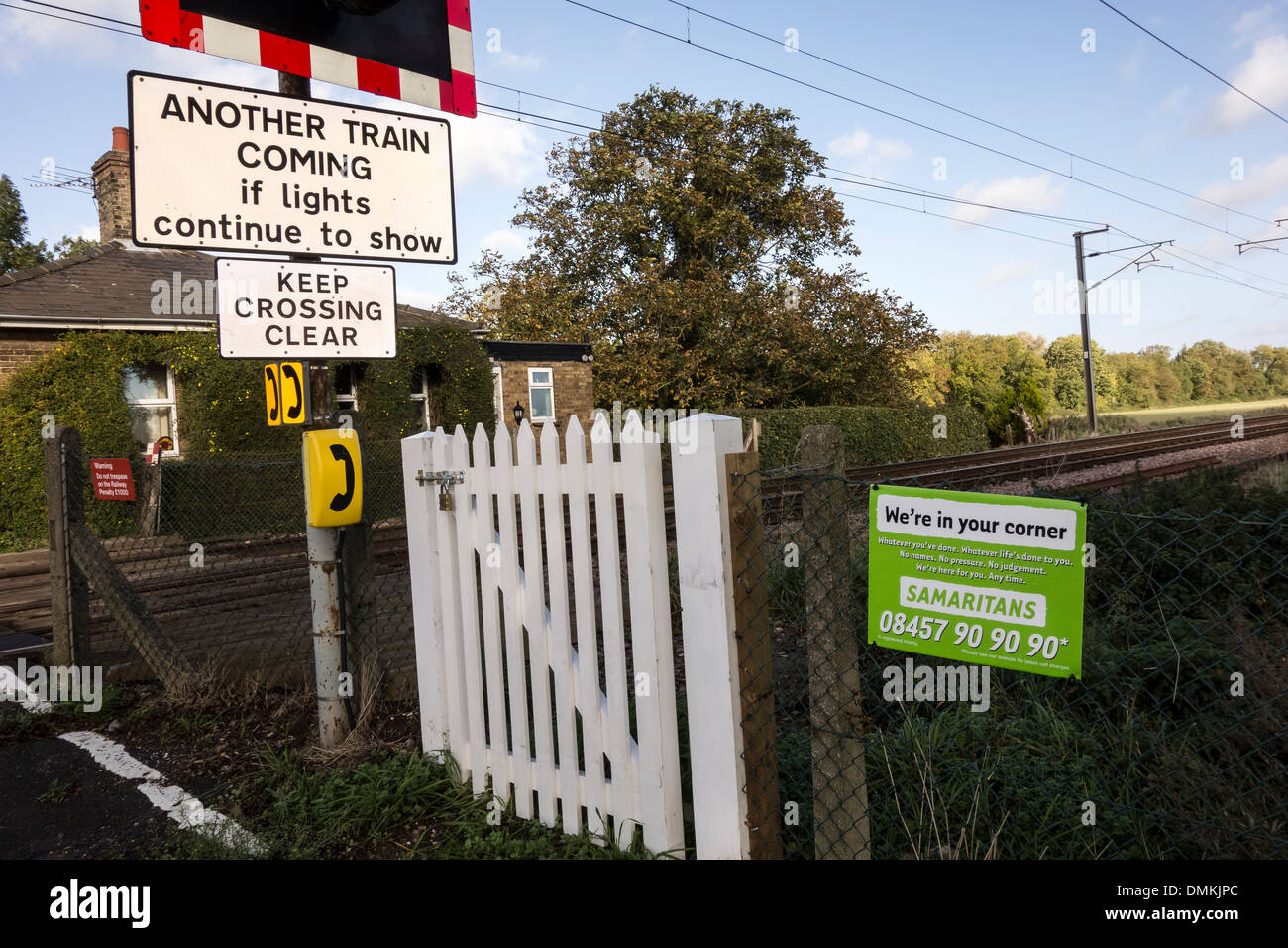 Samaritans sign at railway level crossing Milton England Stock Photo ...