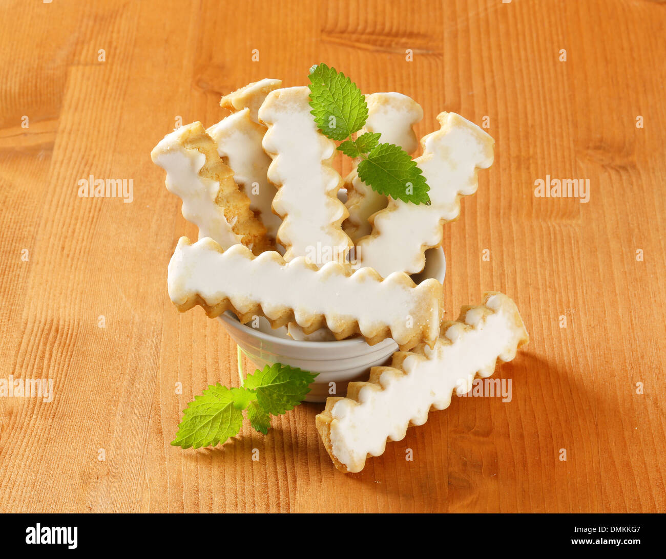 Vanilla cookies with white icing Stock Photo - Alamy