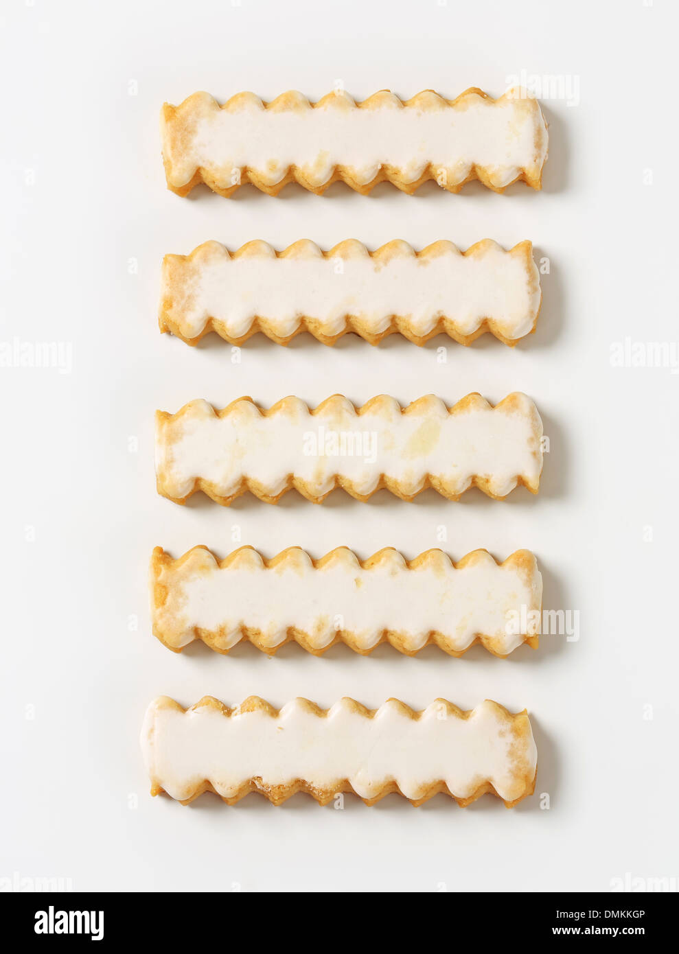 Vanilla cookies with white icing Stock Photo - Alamy