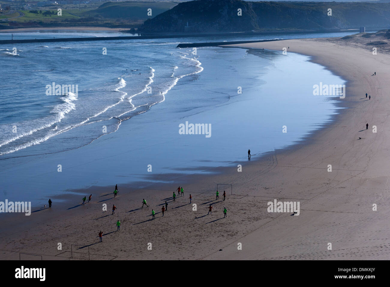 People playing football in La Concha beach, Suances Cantabria Stock ...