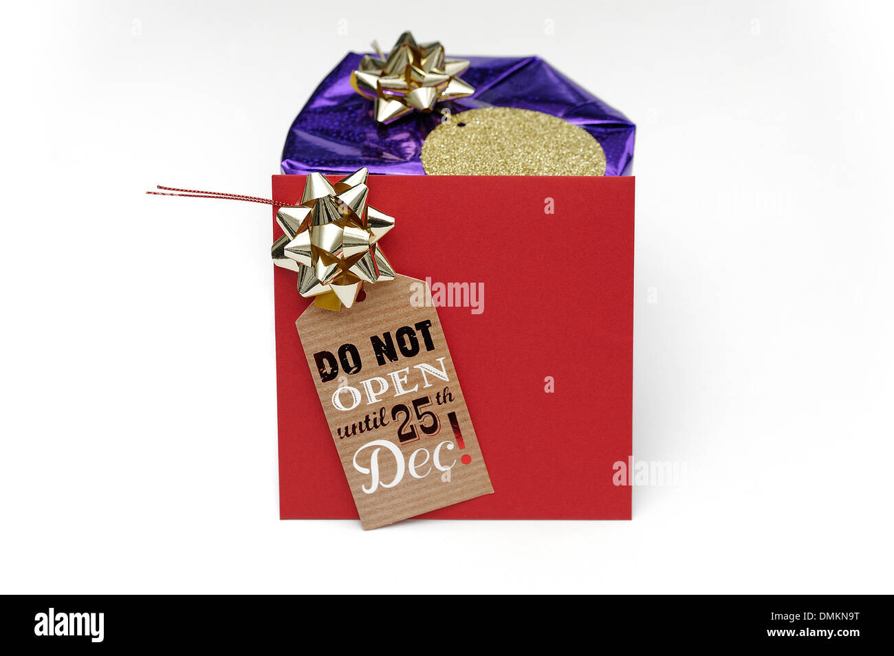 Christmas card and present with tag saying do not open until 25th ...
