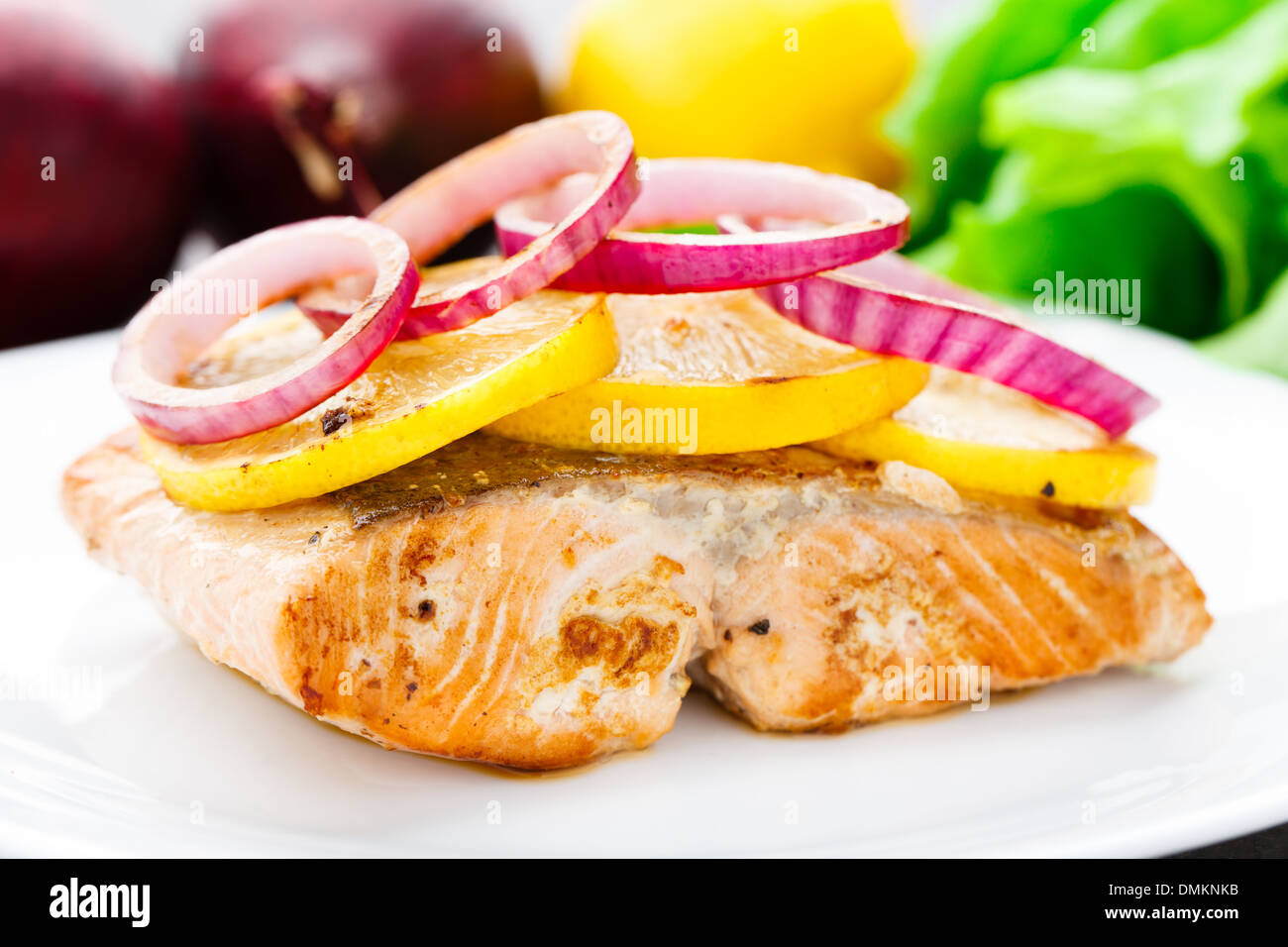 Salmon steak with lemon and onion Stock Photo - Alamy