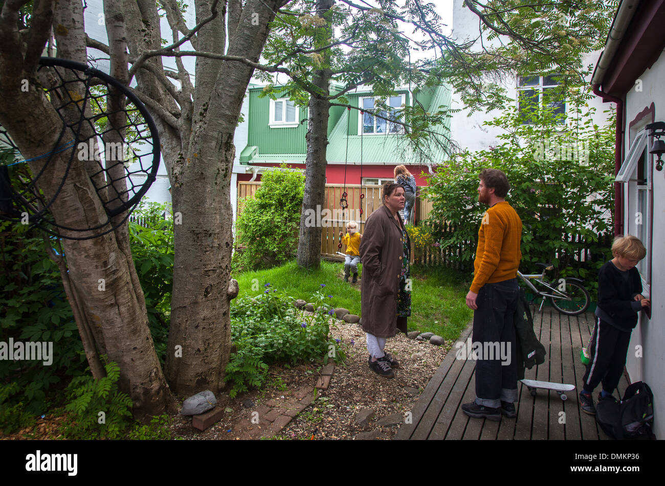 ICELANDIC FAMILY IN THEIR GARDEN, REYKJAVIK, CAPITAL OF ICELAND ...