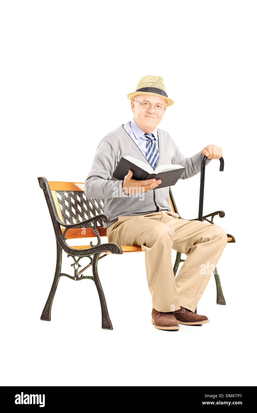 Man sitting bench reading book hi-res stock photography and images - Alamy