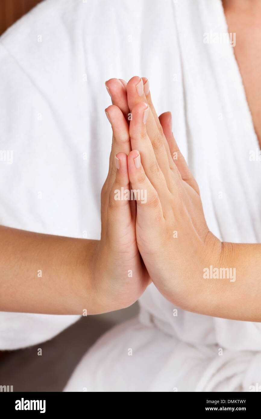 Female Meditating With Hands Clasped Stock Photo - Alamy