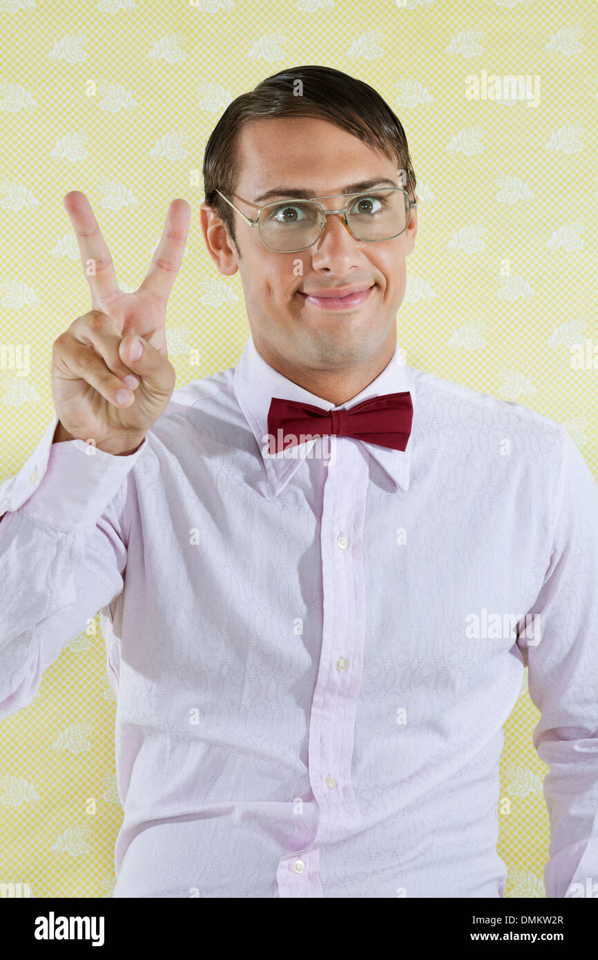 Geek Gesturing Peace Sign Stock Photo - Alamy
