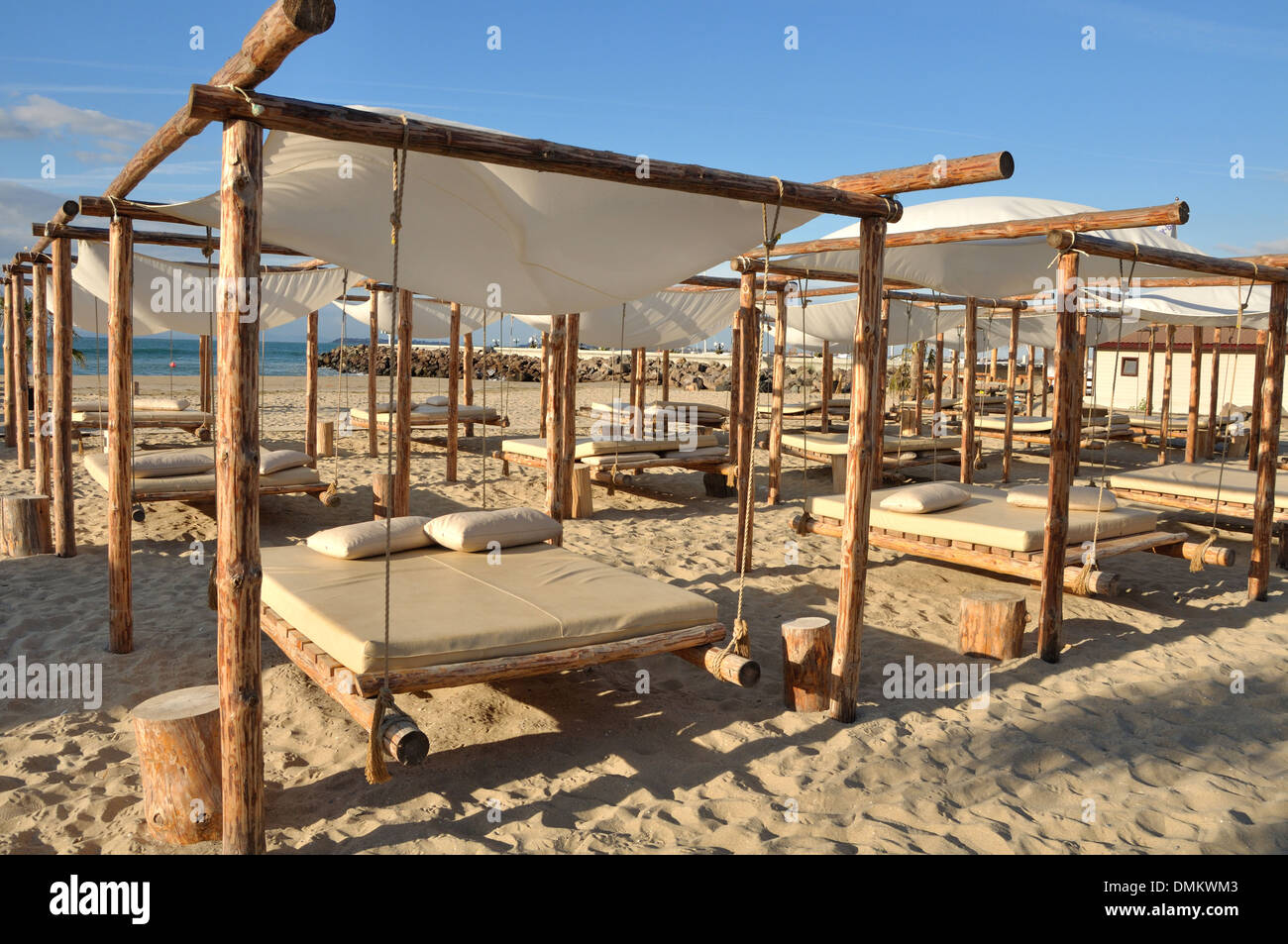 suspended beach beds on sandy beach Stock Photo - Alamy