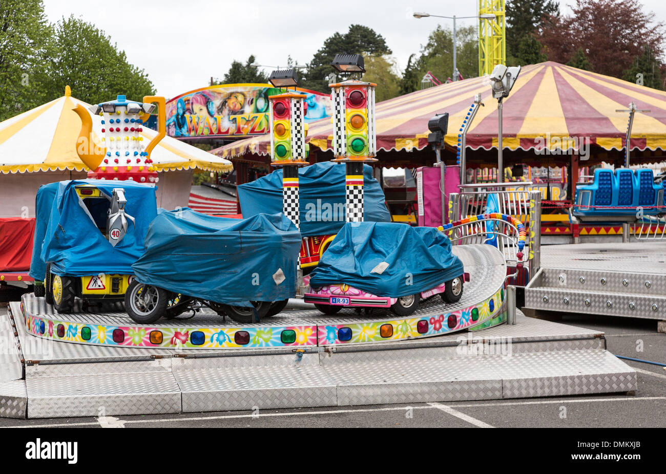 Closed covered fairground rides, UK Stock Photo - Alamy