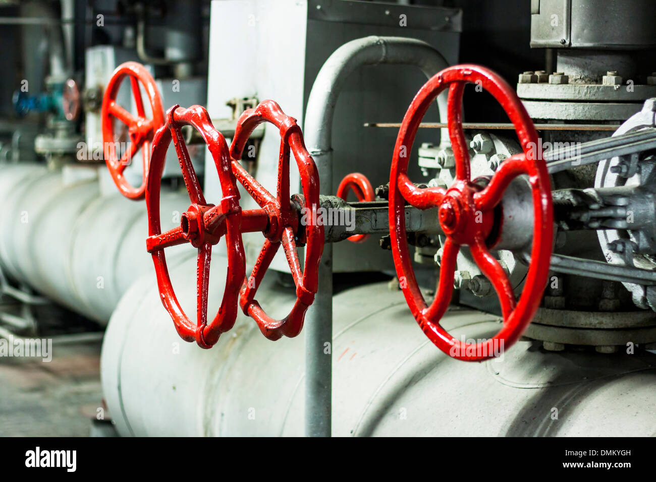 Pipes and red safety valves Stock Photo - Alamy