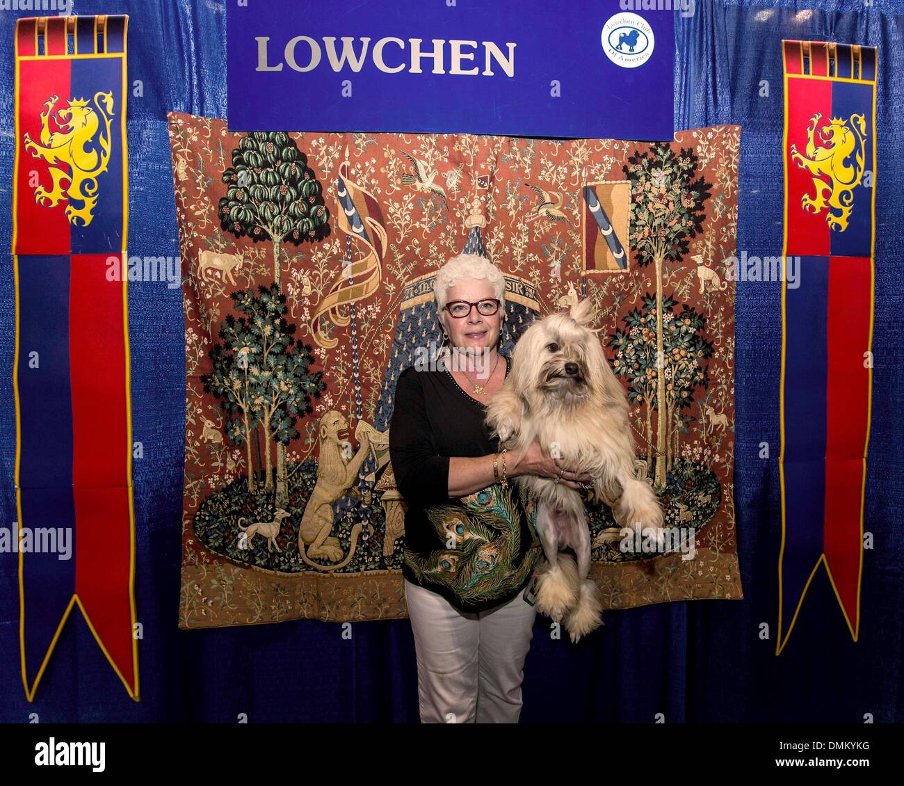 Orlando, Florida, USA. 15th Dec, 2013. VICKI ALL holds Taker, a Lowchen ...
