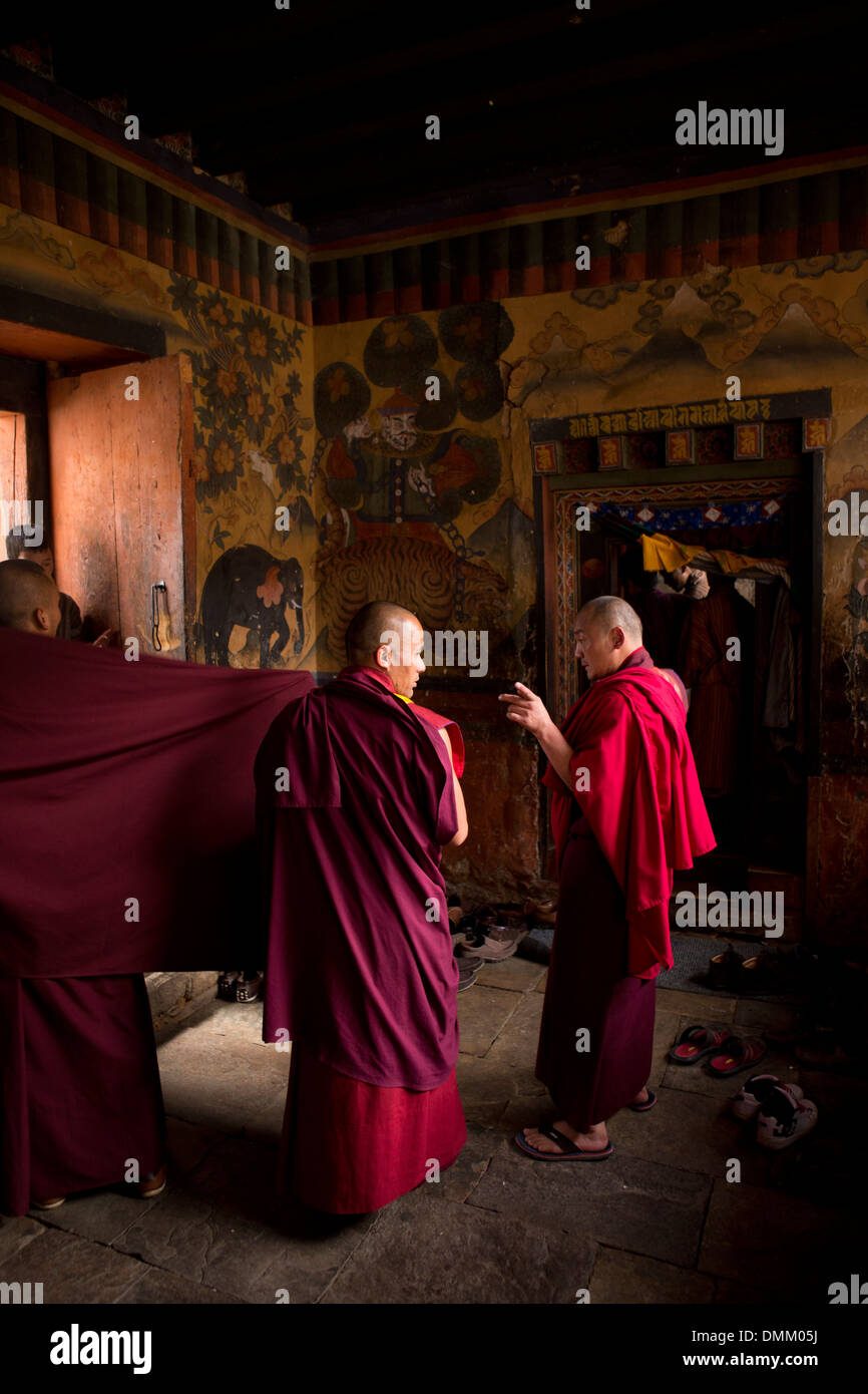 Bhutan, Bumthang Valley, Jambey Lhakang, two Buddhist monks inside ...