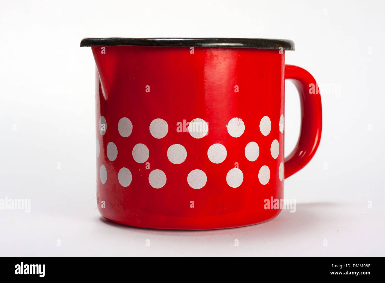 Polka dot mug. metal containers. red with white dots Stock Photo - Alamy