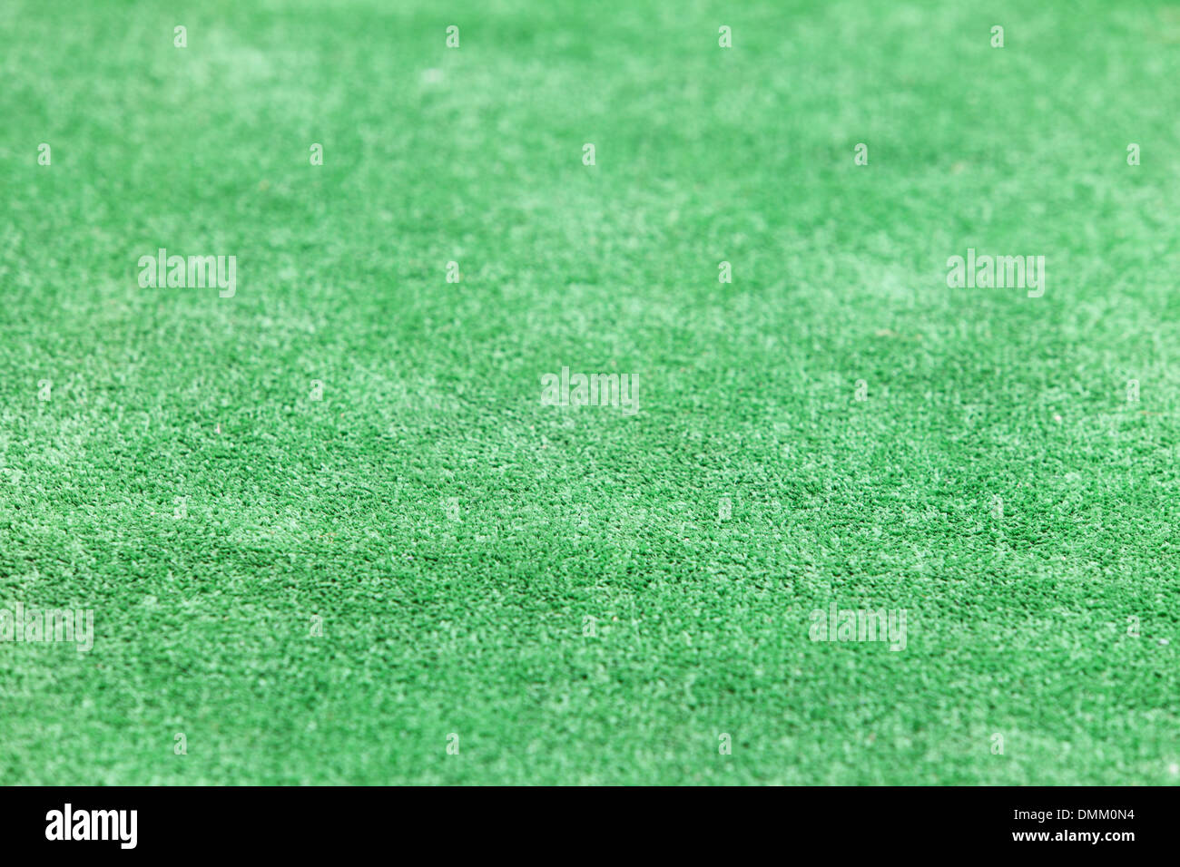 Artificial green grass field turf texture background Stock Photo - Alamy