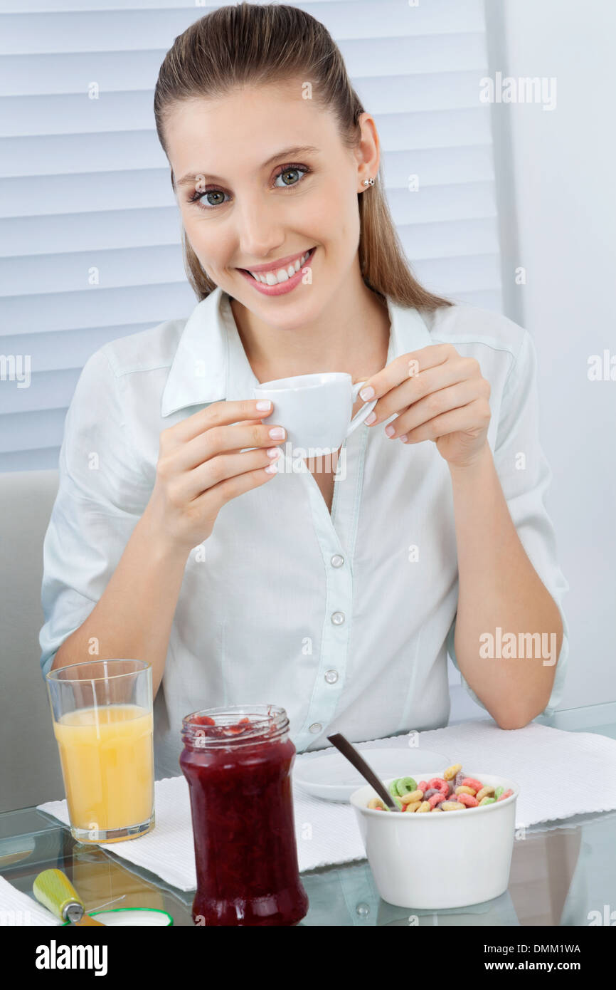 Beautiful Young Woman Having Tea Stock Photo - Alamy