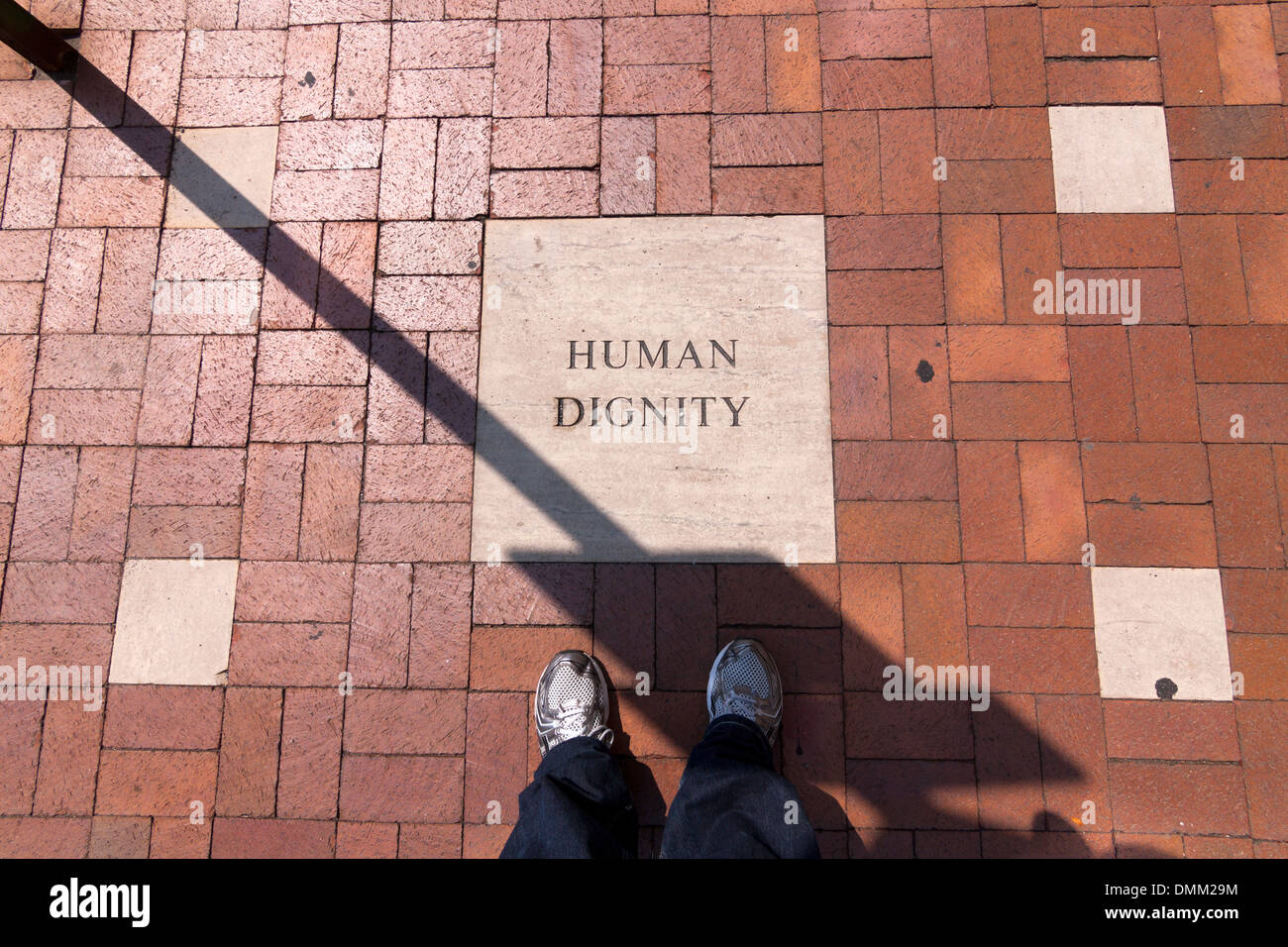Human Dignity sign in sidewalk Stock Photo - Alamy