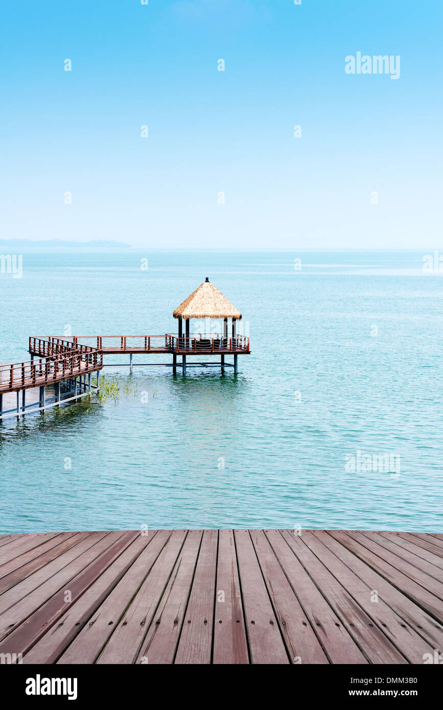 Wooden jetty over the beautiful Maldivian sea with blue sky Stock Photo ...
